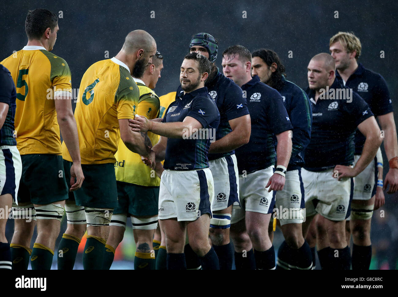 Scotland's Greig Laidlaw (centre) appears dejected as he shakes hands ...