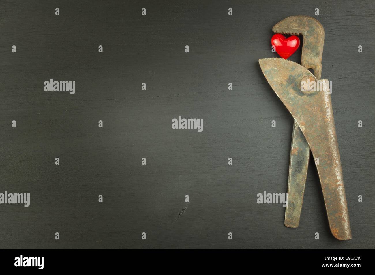 Stress and health. Heart under stress. Rusty vice crushed red heart ...