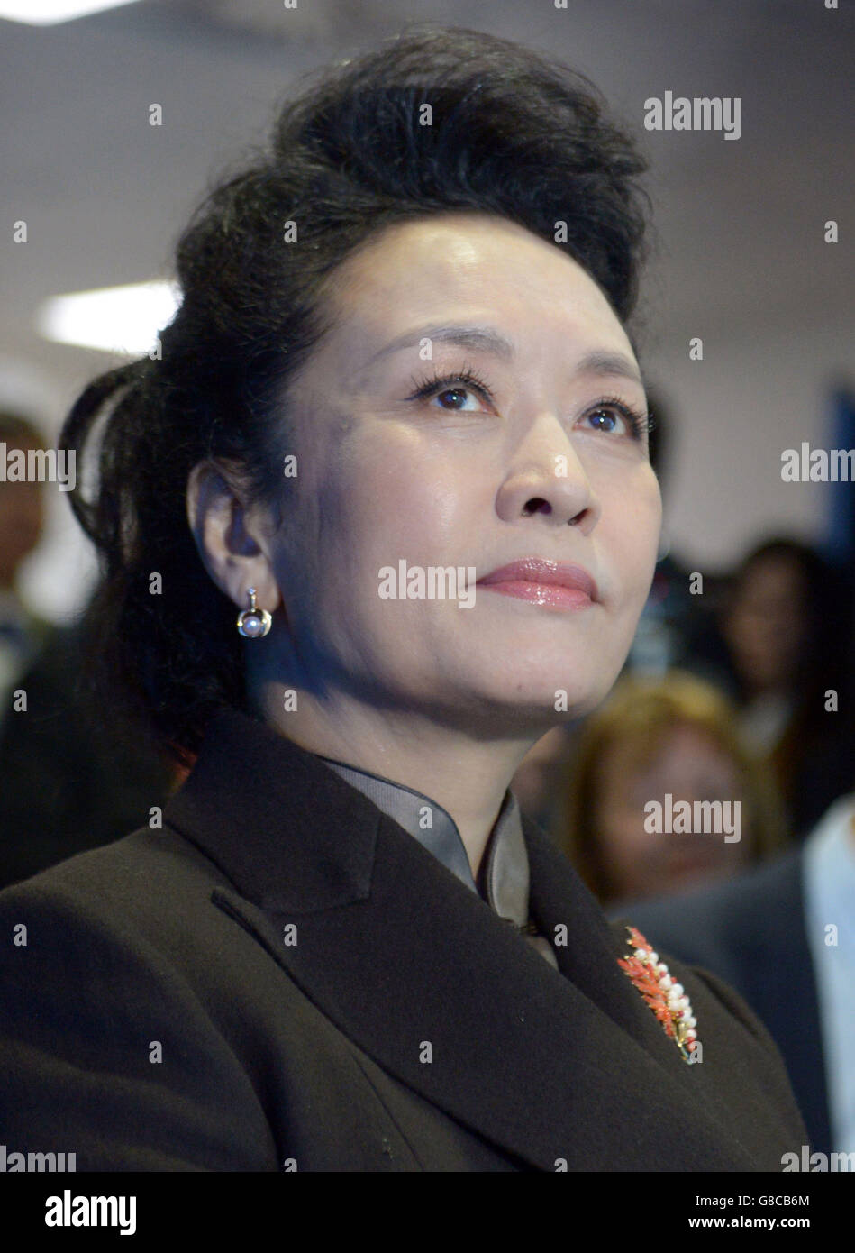 Madame Peng Liyuan listens to Professor Yike Guo (not pictured) during ...