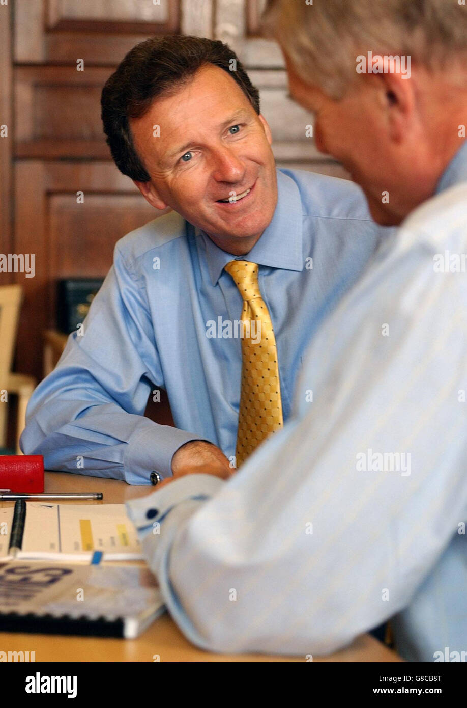 Sir Gus O'Donnell (left) speaks with Sir Andrew Turnbull who he will ...