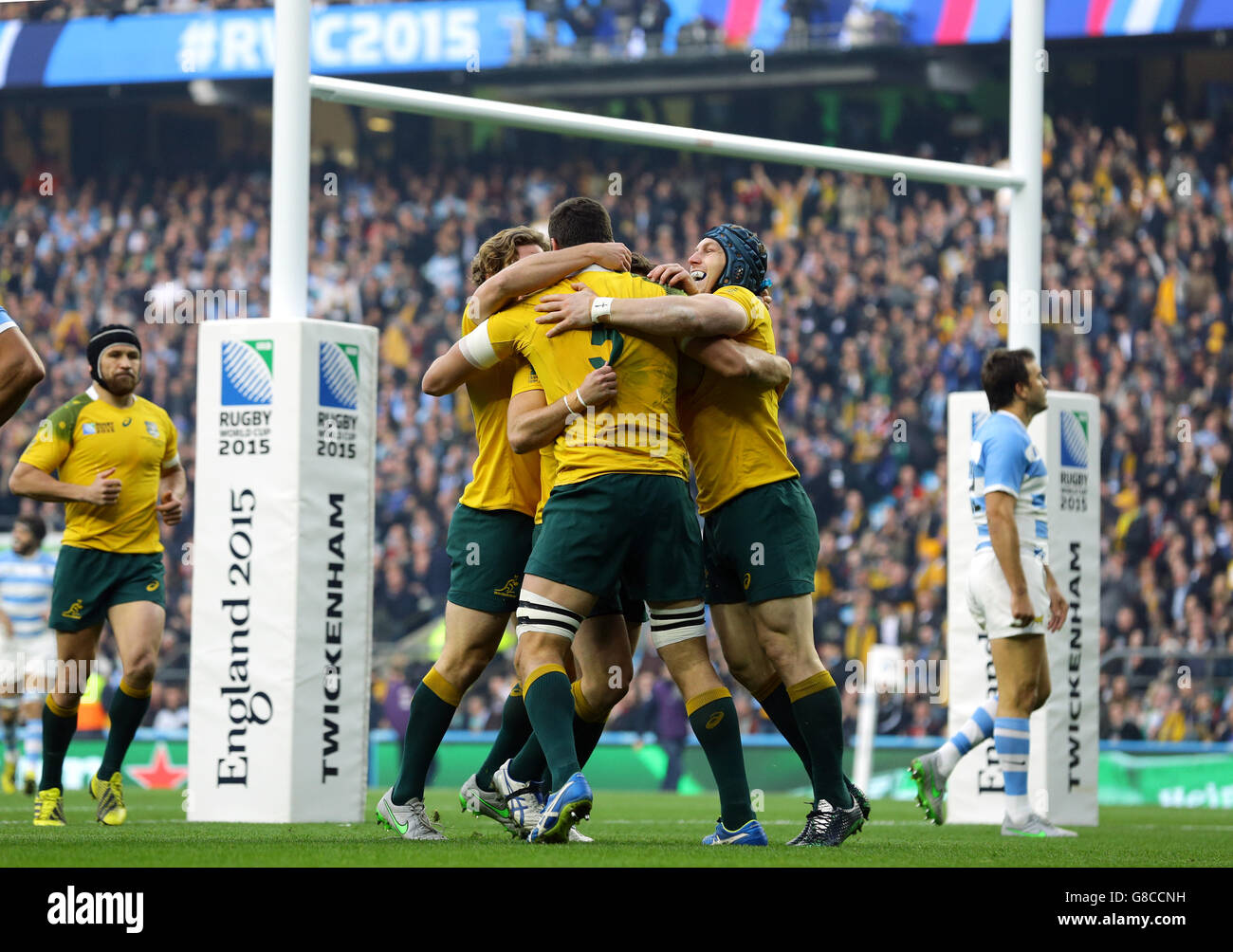 Australia's Rob Simmons (centre) celebrates scoring his side's first ...