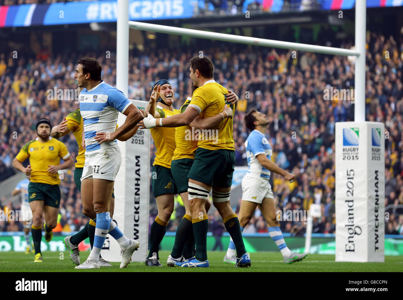 Australia's Rob Simmons (right) celebrates scoring his side's first try ...