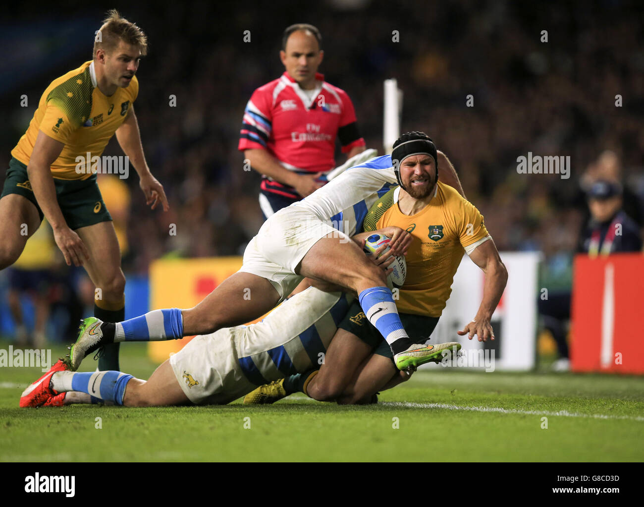Australia's Matt Giteau (right) is tackled during the Rugby World Cup ...