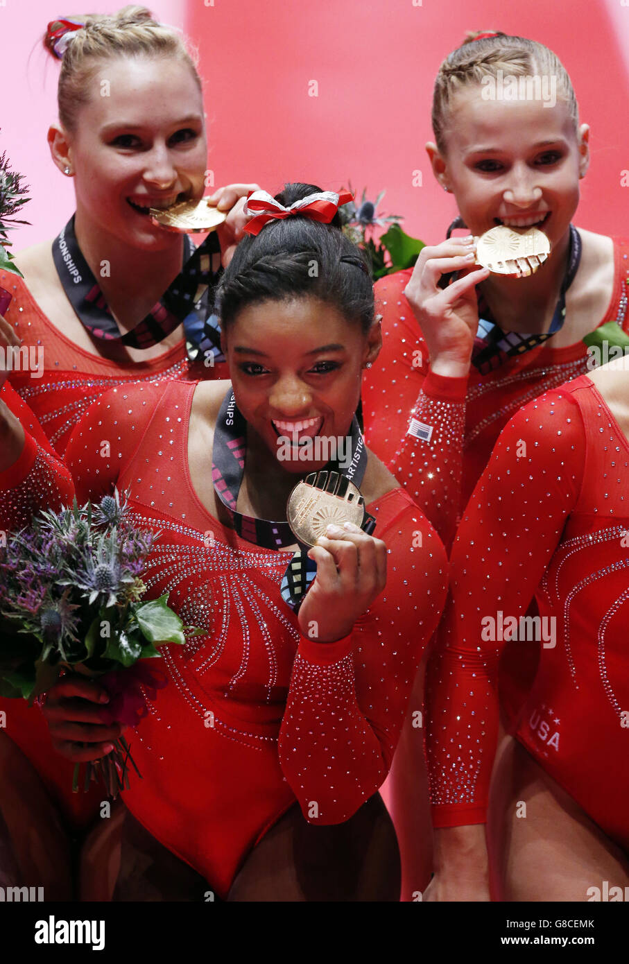 USA's Simone Biles (front) celebrates with teammates after winning a ...