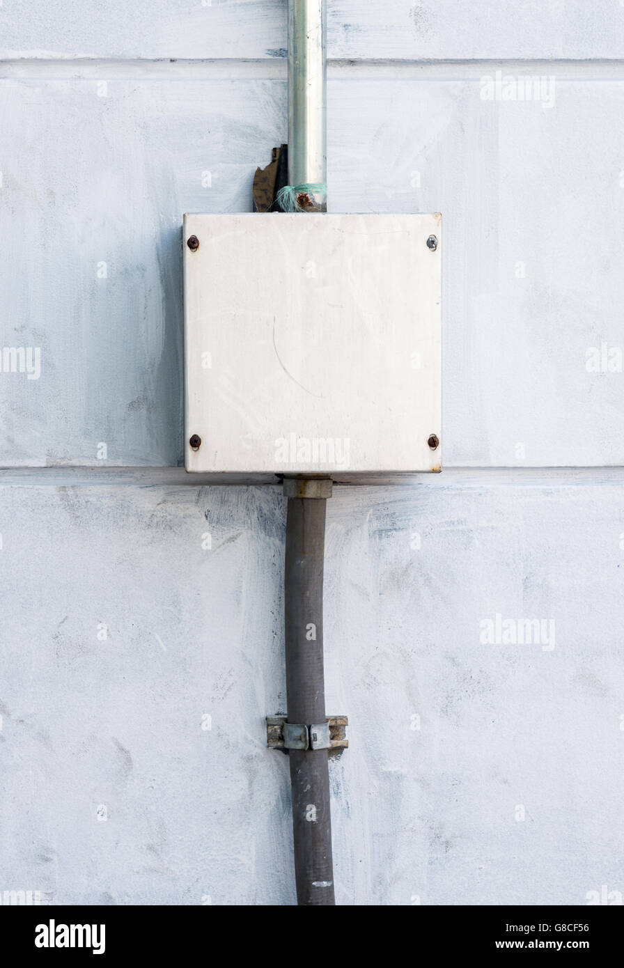Electrical control box on the cement wall of the factory Stock Photo ...