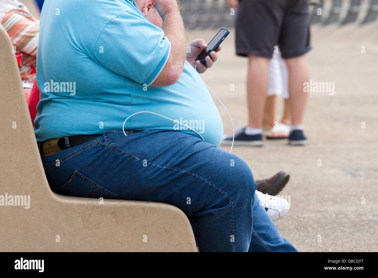 Overweight stomach, abdominal distention, excess belly fat; person ...