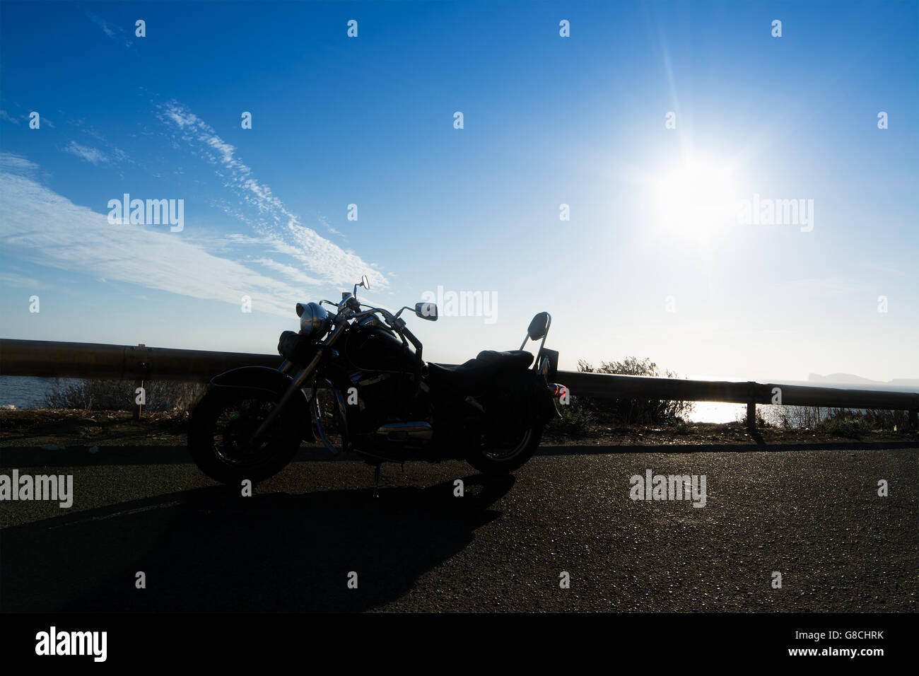 silhouette of a classic motorcycle under a bright sun Stock Photo - Alamy