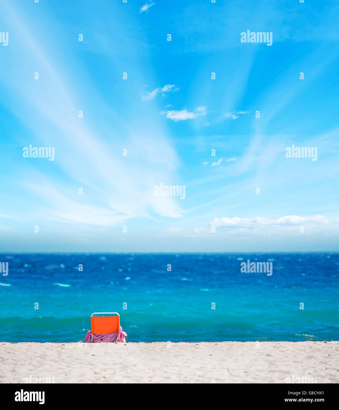 orange beach chair by the shore in Sardinia Stock Photo - Alamy