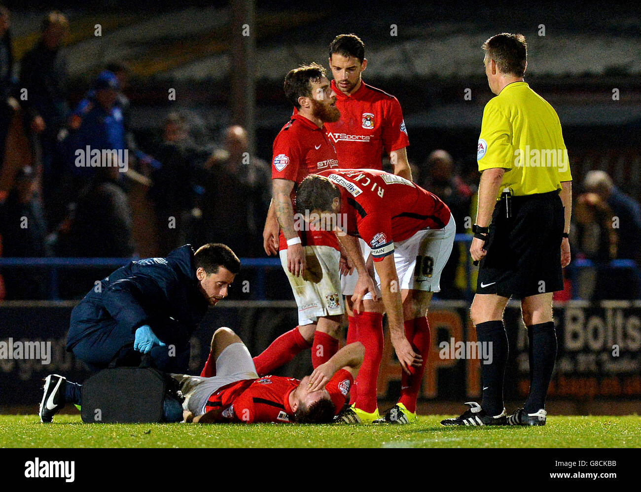 Coventry City's Chris Stokes lies injured on the pitch Stock Photo - Alamy