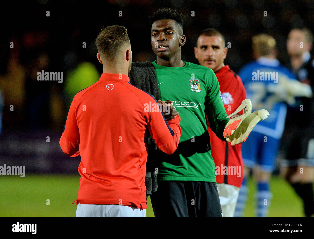 Coventry City goalkeeper Reice Charles-Cook (right) shakes hands with ...
