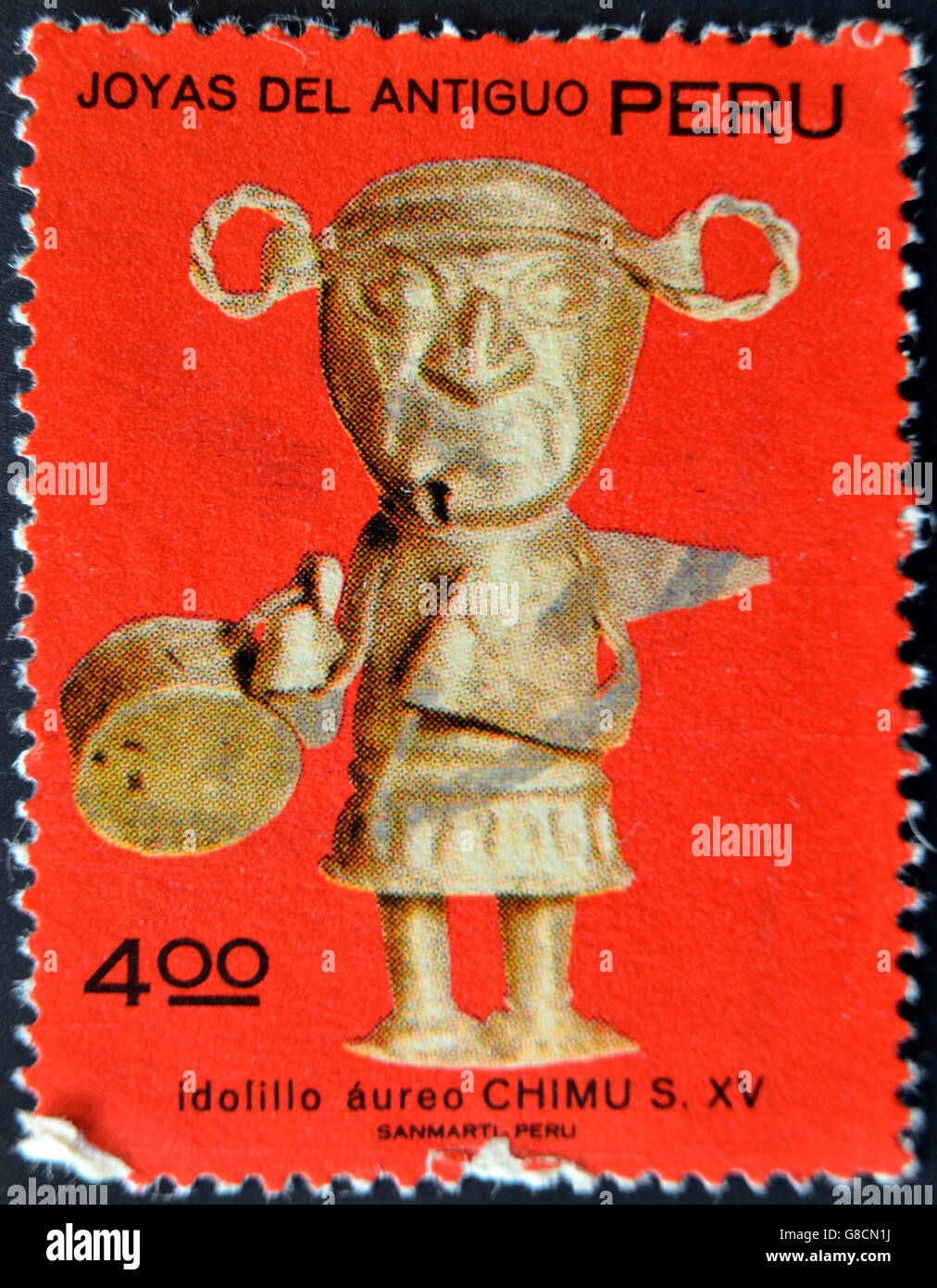 PERU - CIRCA 1987: A stamp printed in Peru shows Chimu aureus idol ...