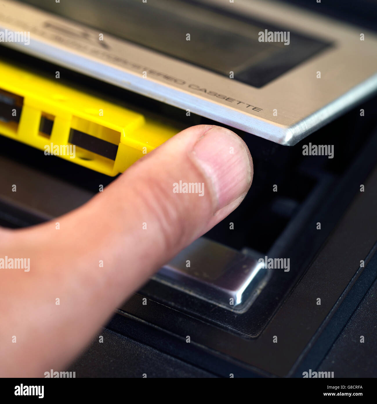 Loading music compact cassette Stock Photo - Alamy