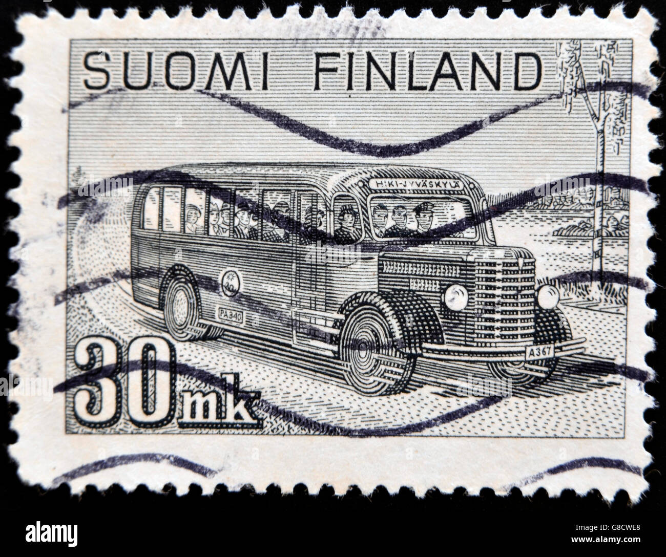 FINLAND - CIRCA 1946: A stamp printed in Finland shows retro post bus ...