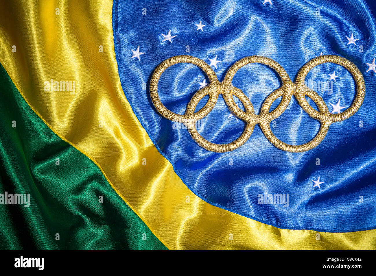 RIO DE JANEIRO - FEBRUARY 3, 2016: Gold Olympic rings symbol sits on ...