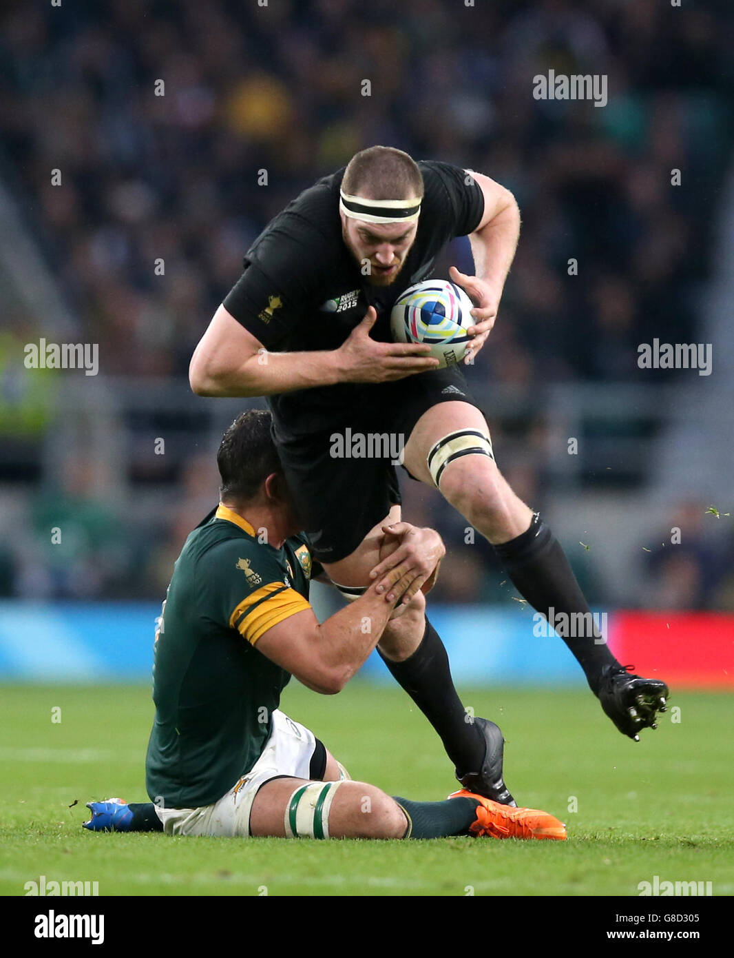 New Zealand's Brodie Retallick is tackled by South Africa's Francois ...