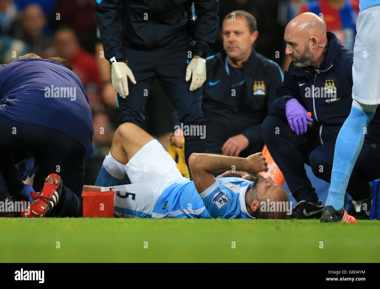 Manchester City's Pablo Zabaleta is treated by medical staff after ...