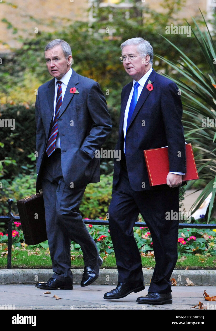 Defence Secretary Michael Fallon (right), arrives in Downing Street ...