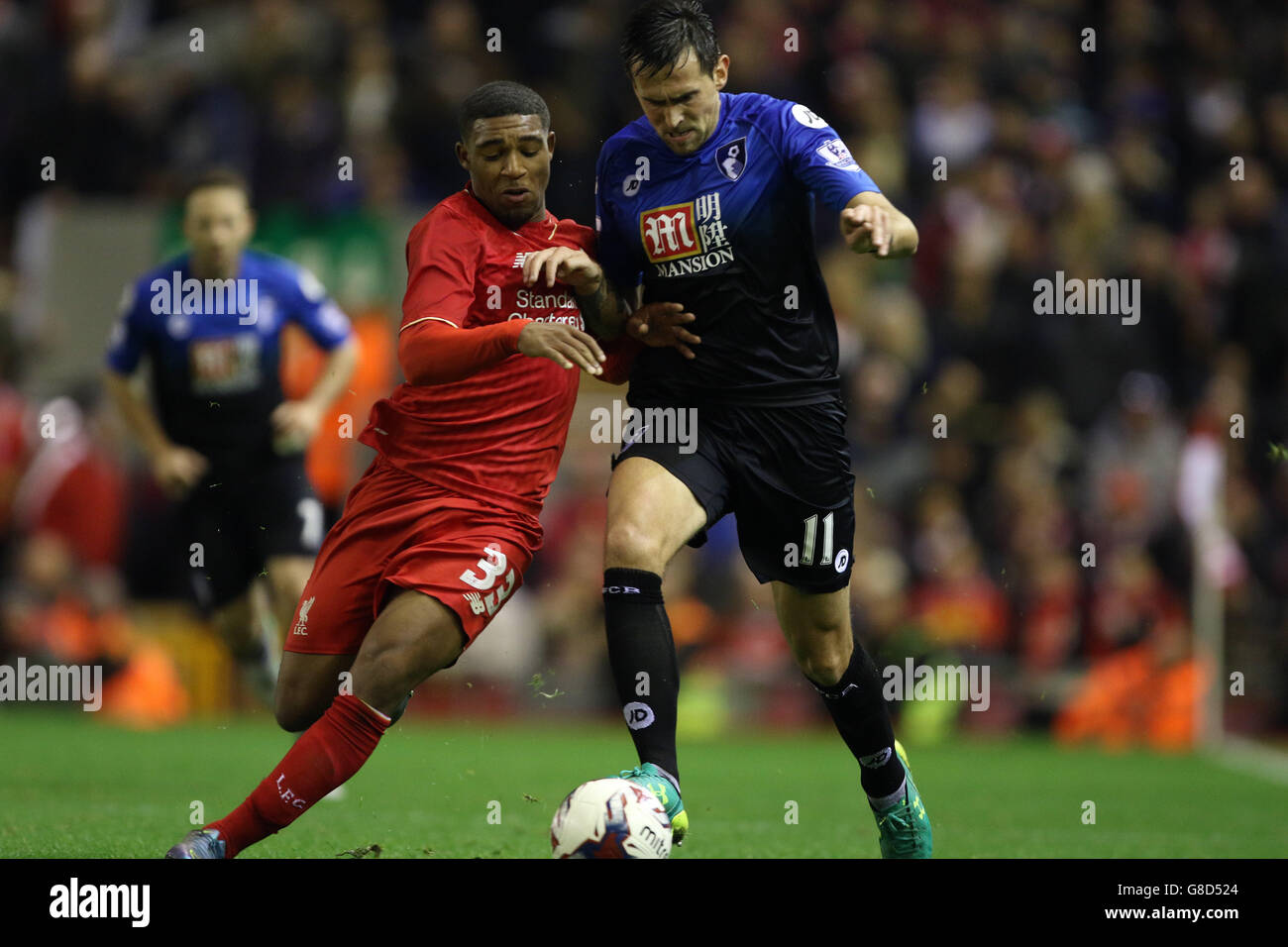 AFC Bournemouth's Charlie Daniels (right) holds off Liverpool's Jordon ...