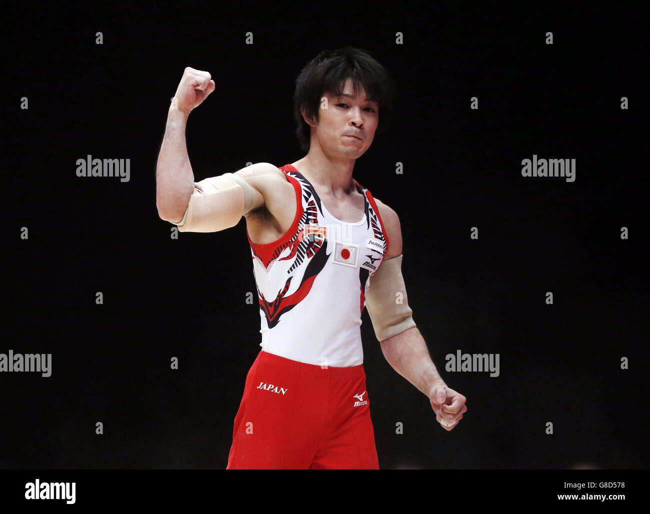 Japan's Kohei Uchimura celebrates after competing on the Parallel Bars ...