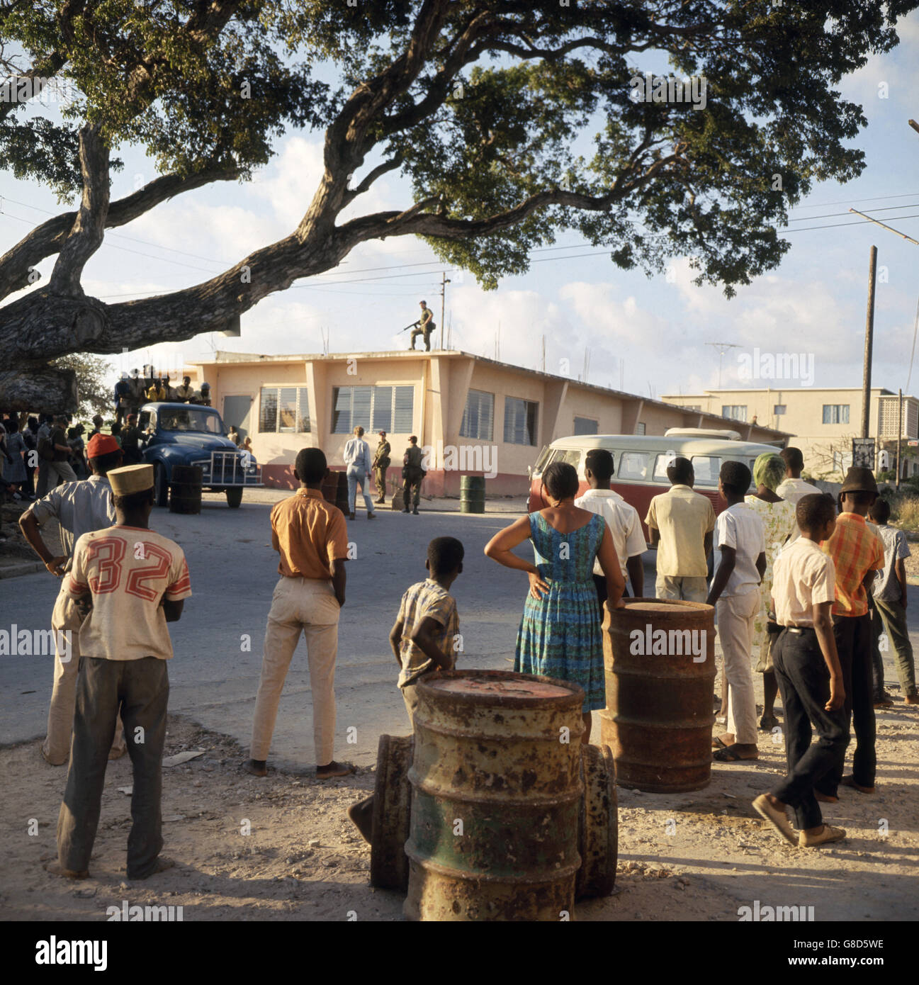 Anguillans look on as british paratroopers guard street intersection ...