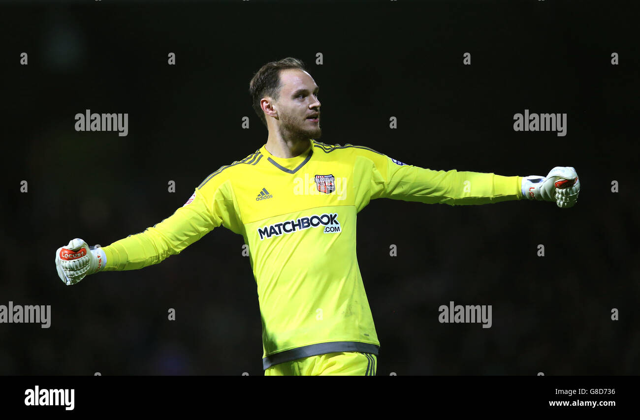 Brentford goalkeeper David Button celebrates after teammate Brentford's ...