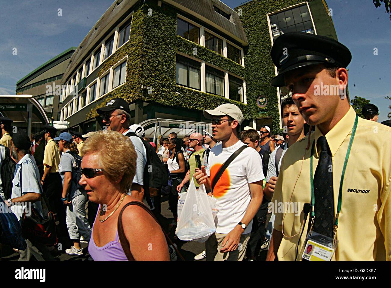 Crowds queue up outside the All England Club on the Fourth Day of the ...
