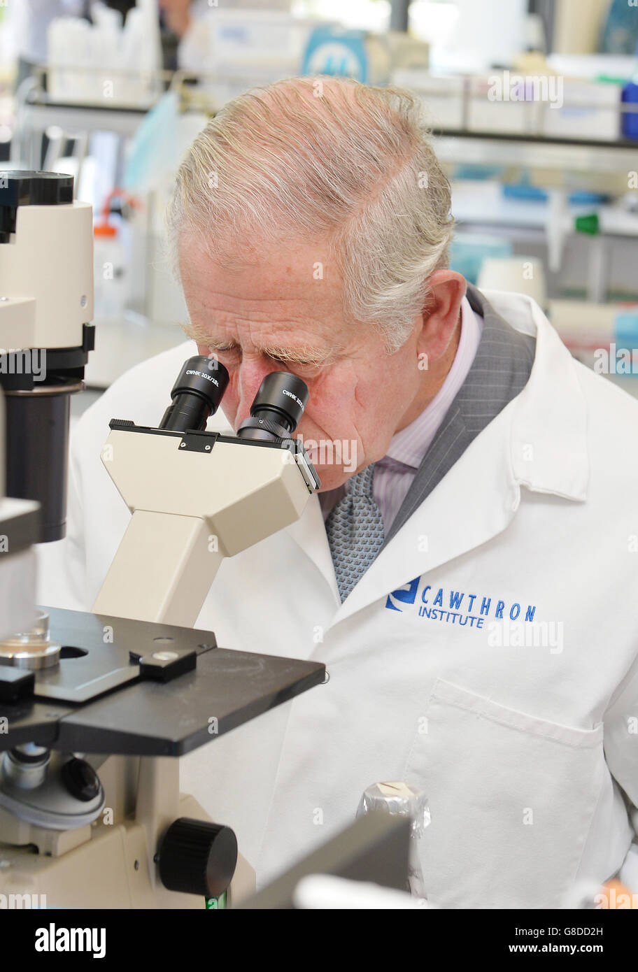 The Prince of Wales during looks through a microscope during a visit to ...