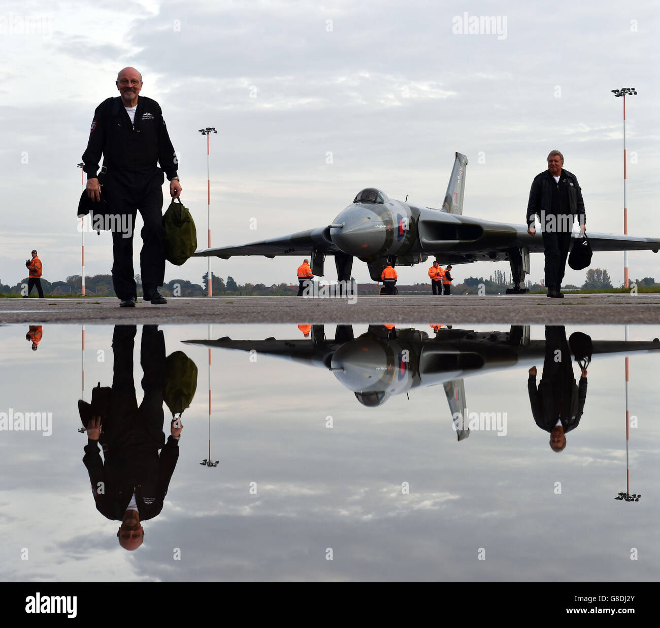 Members of the crew of Vulcan XH558, a restored nuclear bomber, walk ...