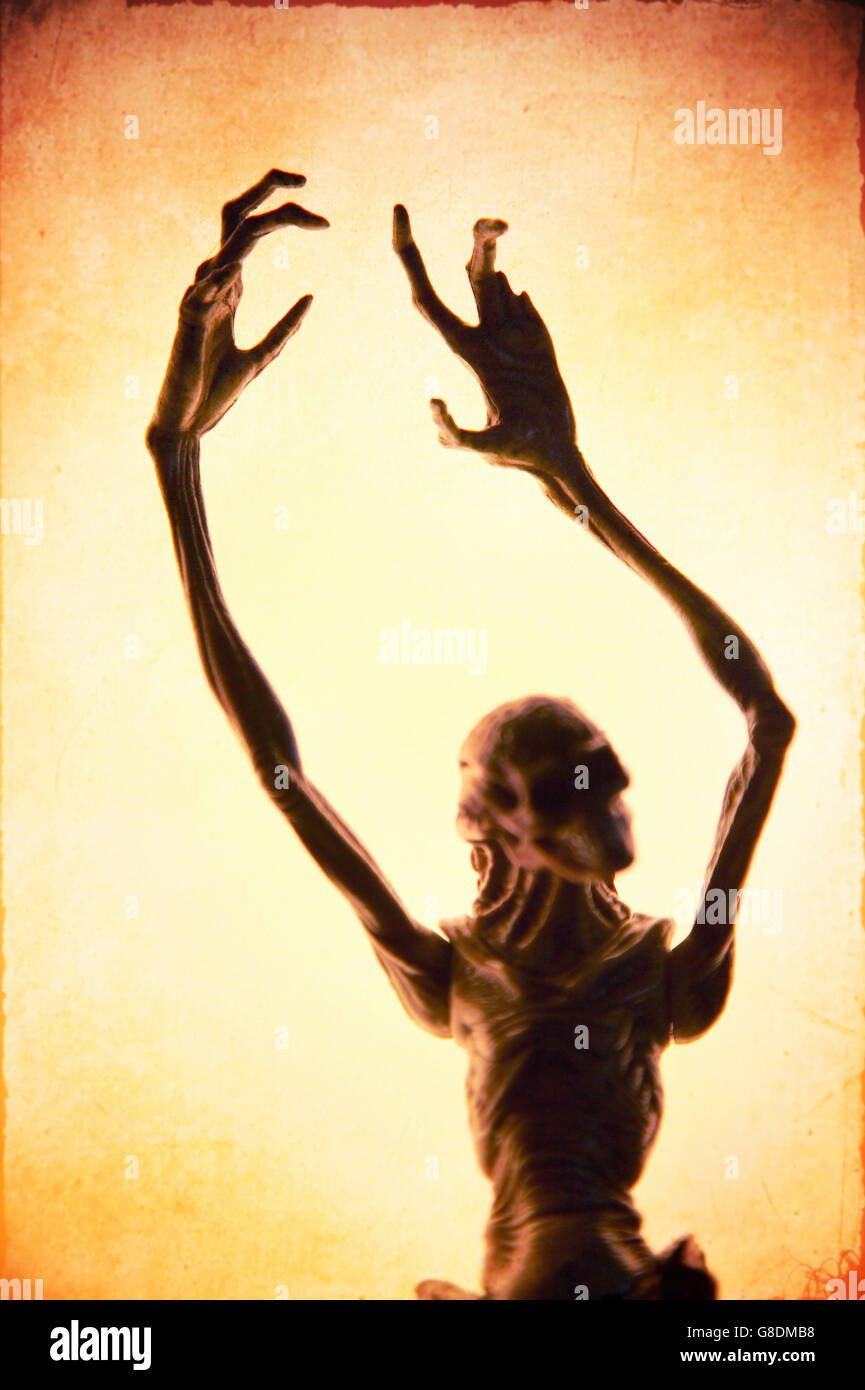 Alien monster arms raised hi-res stock photography and images - Alamy