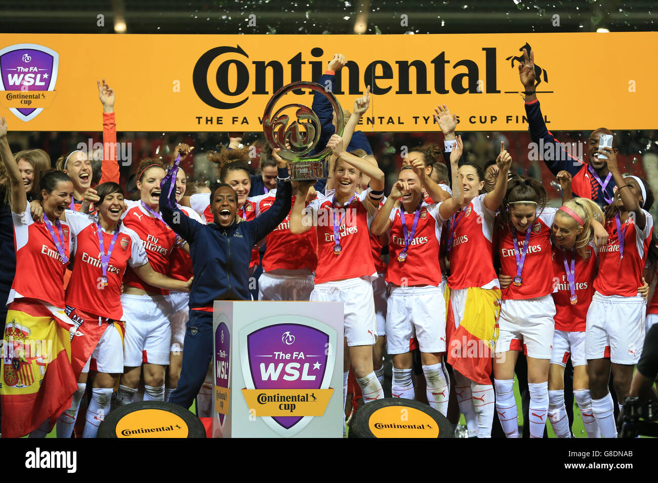 Arsenal Ladies captain Casey Stoney (centre right) lifts the trophy ...