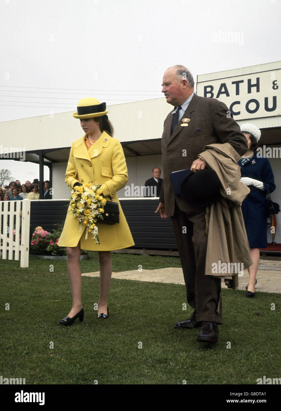Princess Anne, wearing a yellow coat and hat, at the Bath and West Show ...