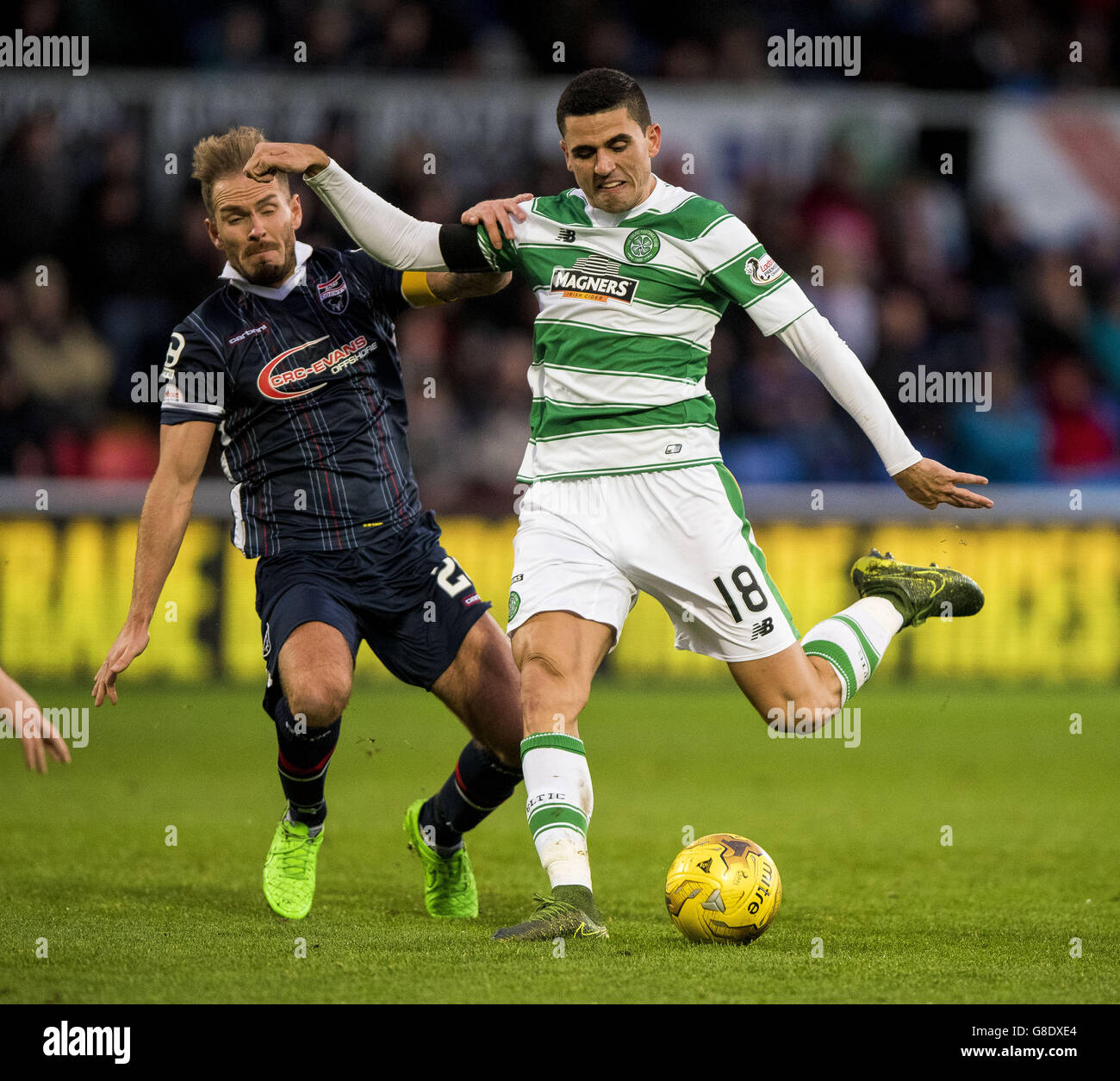 Ross County's Martin Woods and Celtic's Tomas Rogic (right) compete for ...