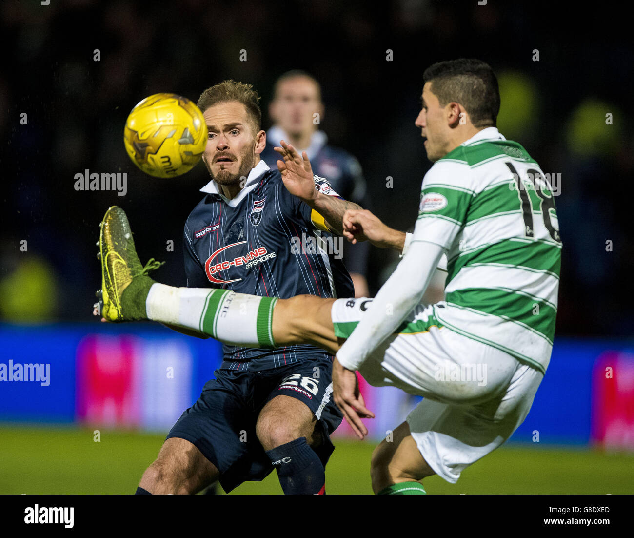Ross County's Martin Woods and Celtic's Tomas Rogic (right) compete for ...