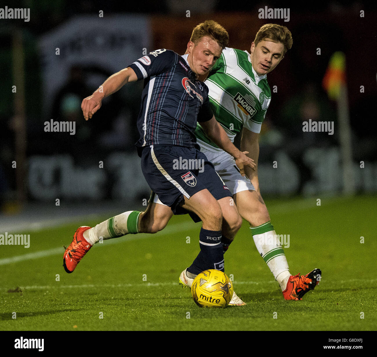 Ross County's Tony Dingwall (left) and Celtic's James Forrest compete ...