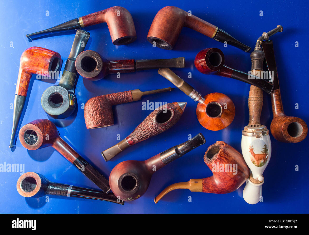 Members of the Pipe-Club-Wriezen competing in smoking a pipe as slow as ...
