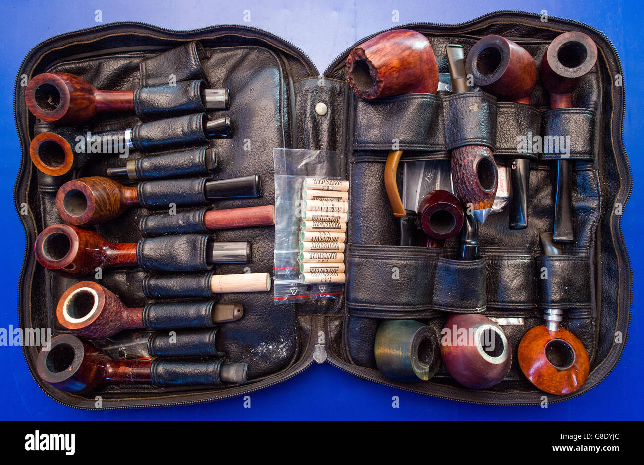 Members of the Pipe-Club-Wriezen competing in smoking a pipe as slow as ...