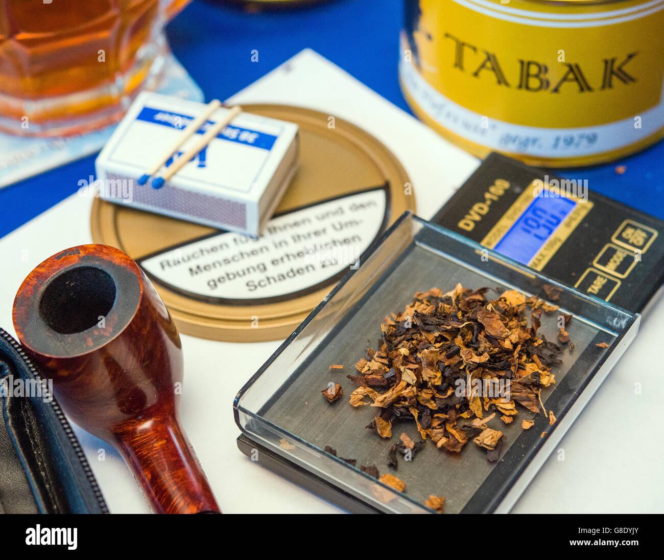 Members of the Pipe-Club-Wriezen competing in smoking a pipe as slow as ...