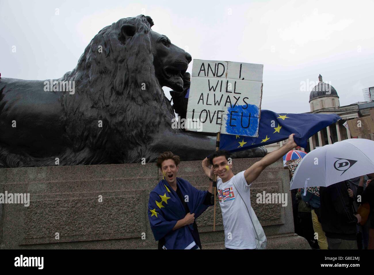 London, UK. 28th June, 2016. Two young men in front of a lion in ...