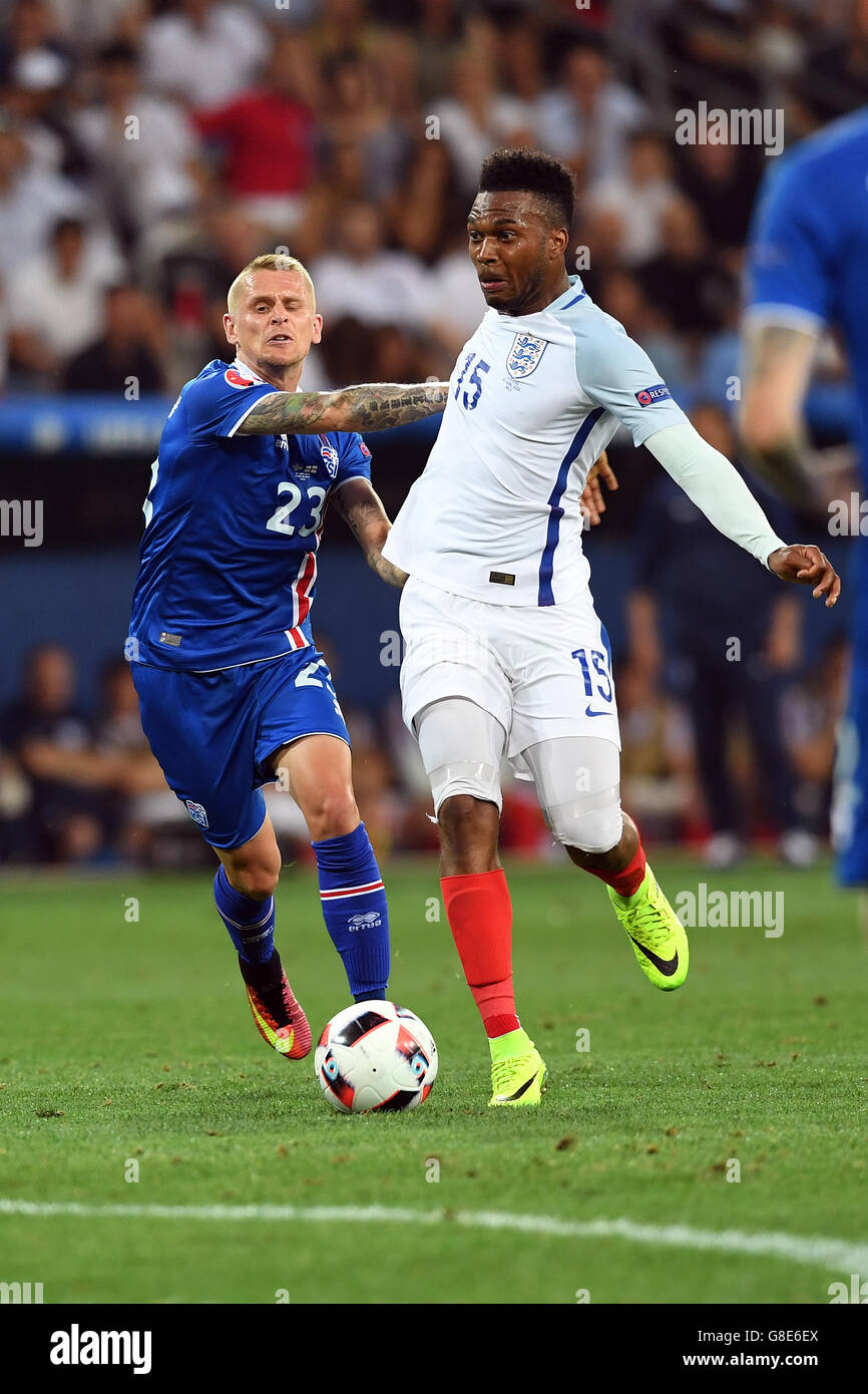 Nice, France. 27th June, 2016. Ari Freyr Skulason (L) of Iceland and ...