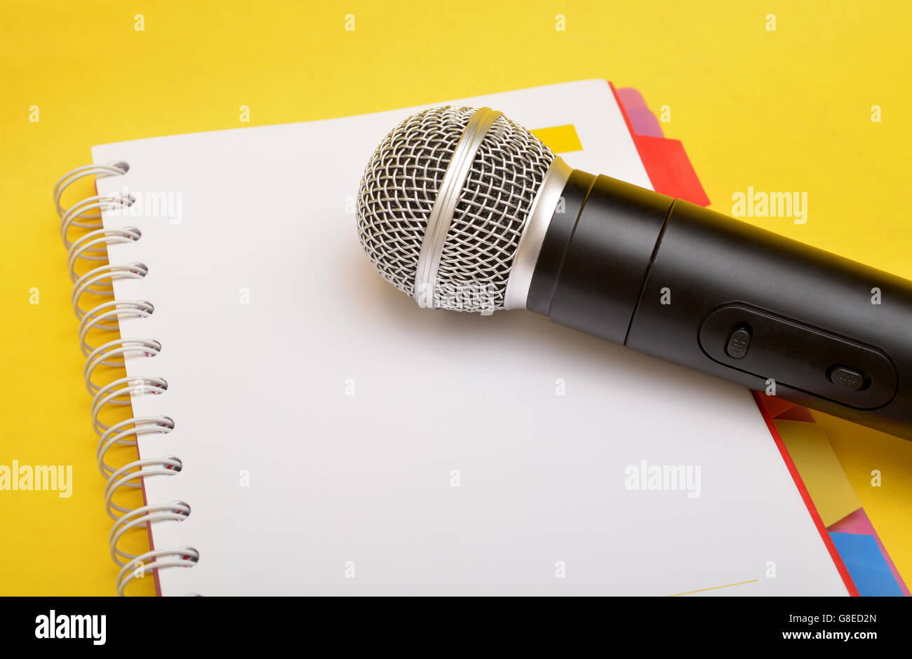 Wireless microphone with note book - motivational speaker Stock Photo ...