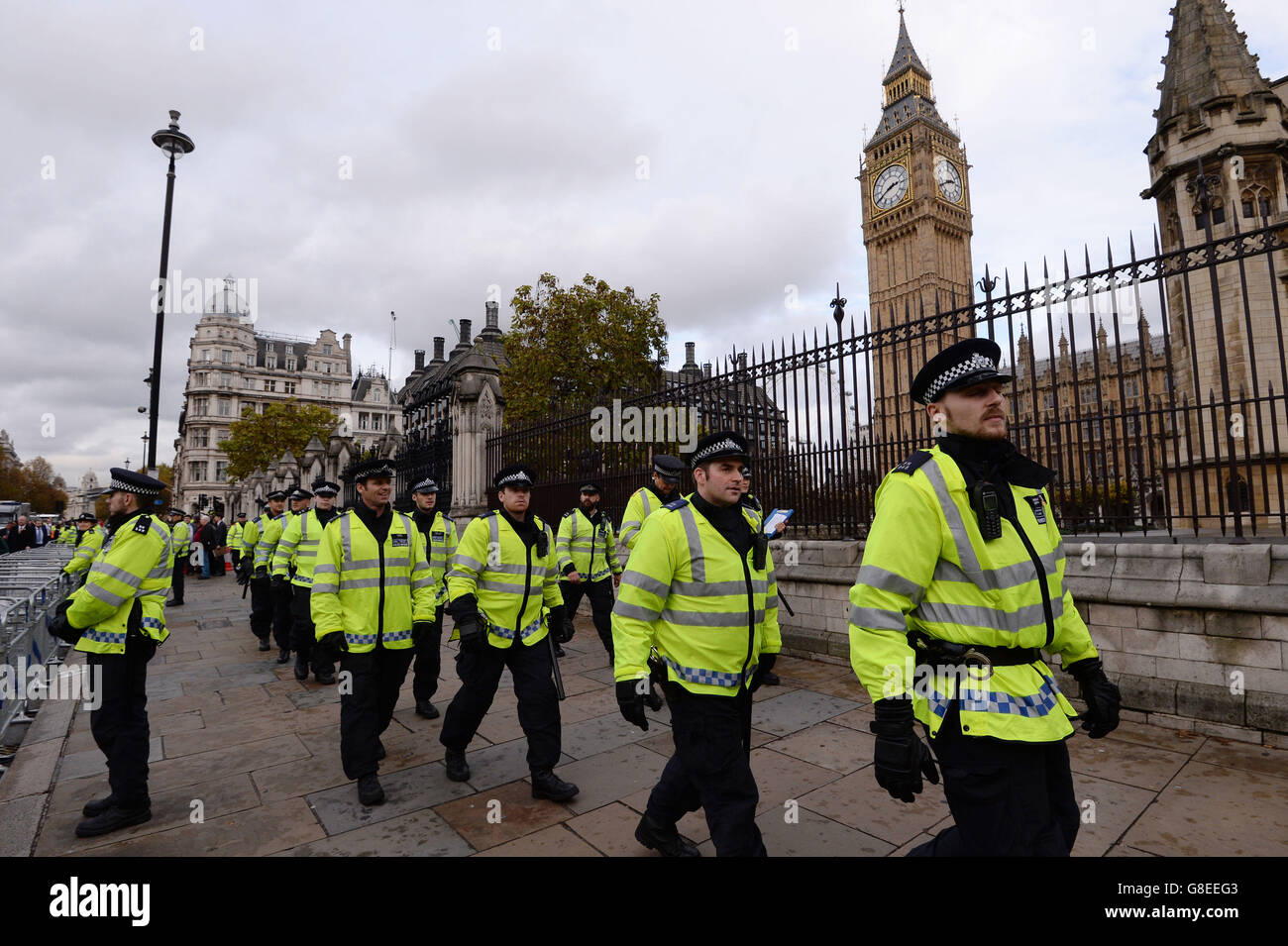 Police walk past the Houses of Parliament in London, during a march and ...