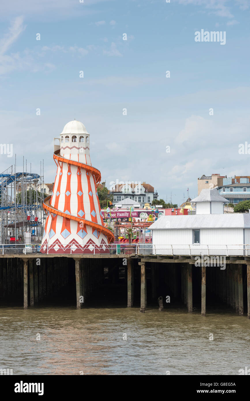 Clacton Pier with the funfair and helter skelter and amusement arcades ...