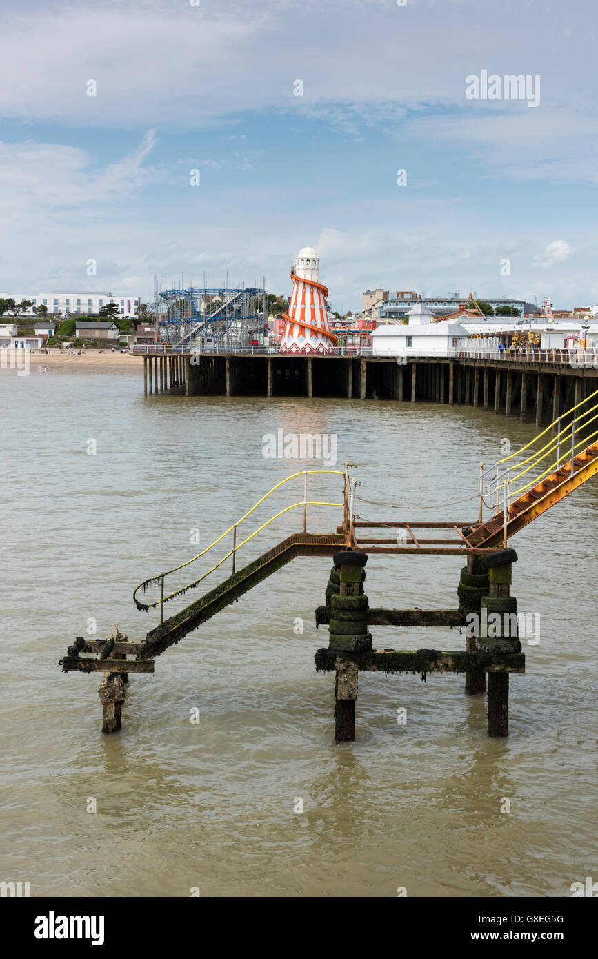 Clacton Pier with the funfair and helter skelter and amusement arcades ...