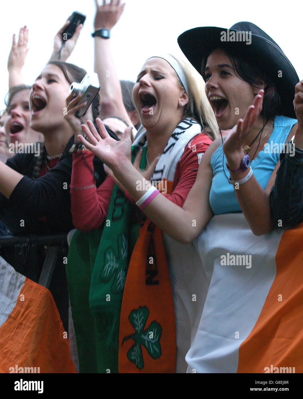 Showbiz music fans crowd screaming ireland flags hi-res stock ...