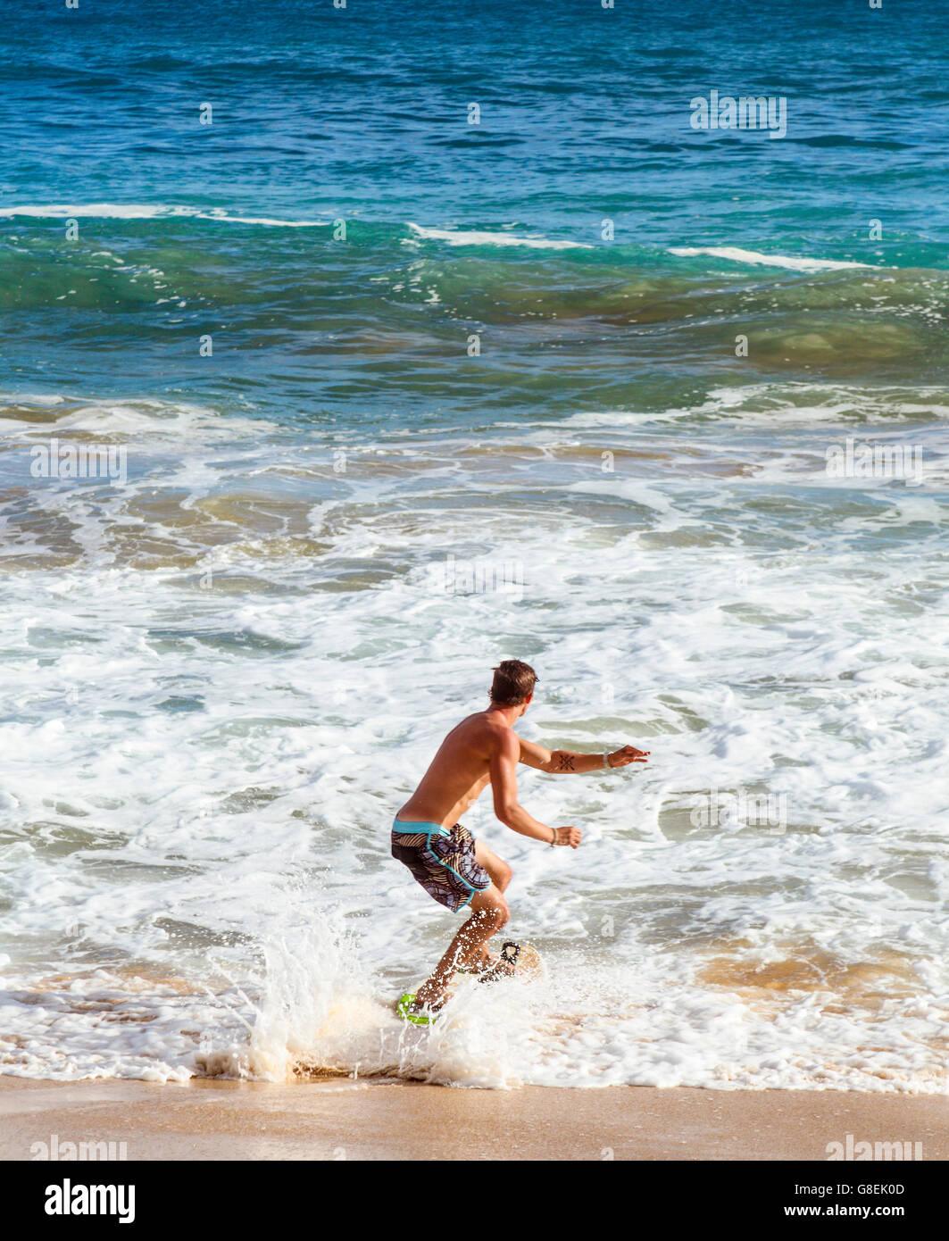 Skimboarder at Big Beach at Makena State Park Stock Photo - Alamy