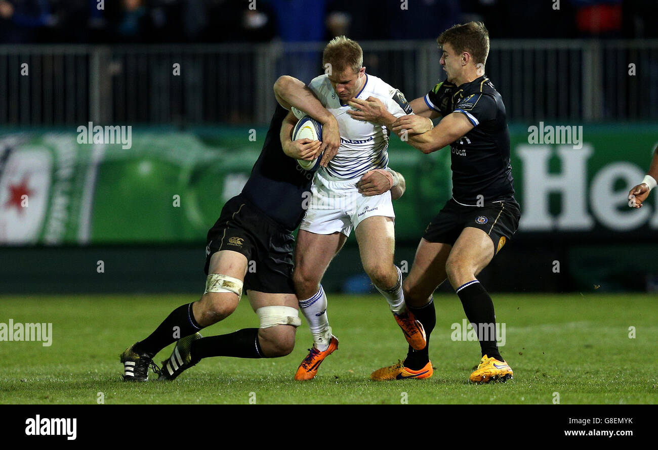 Leinster's Luke Fitzgerald is tackled by Bath's Ollie Devoto and Dave ...
