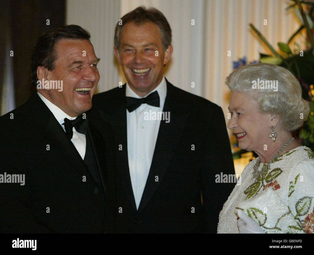 Queen Elizabeth II shares a joke with German Chancellor Gerhard ...