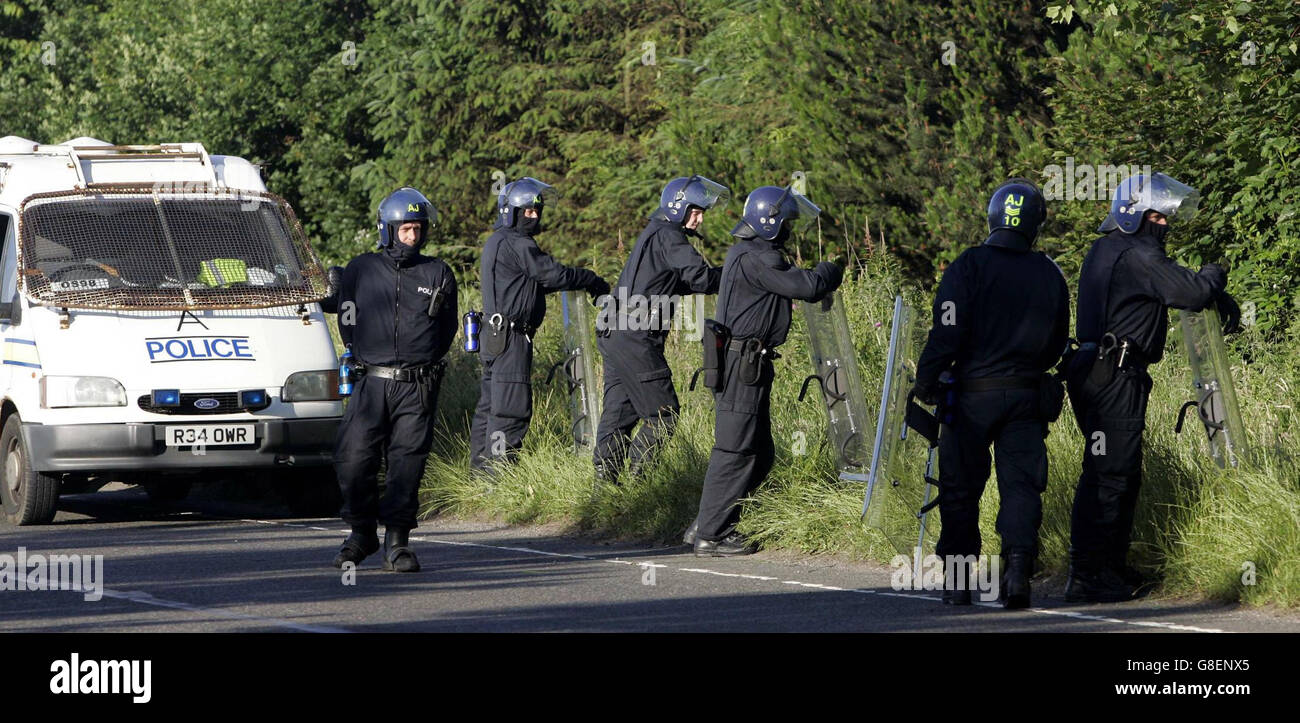 Riot police surround the eco-camp housing thousands of G8 protesters ...