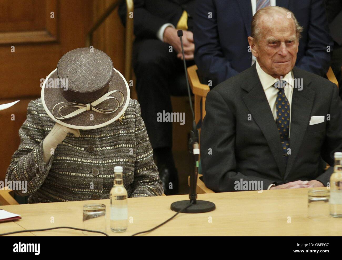 Queen Elizabeth II and the Duke of Edinburgh listen to a speech by the ...