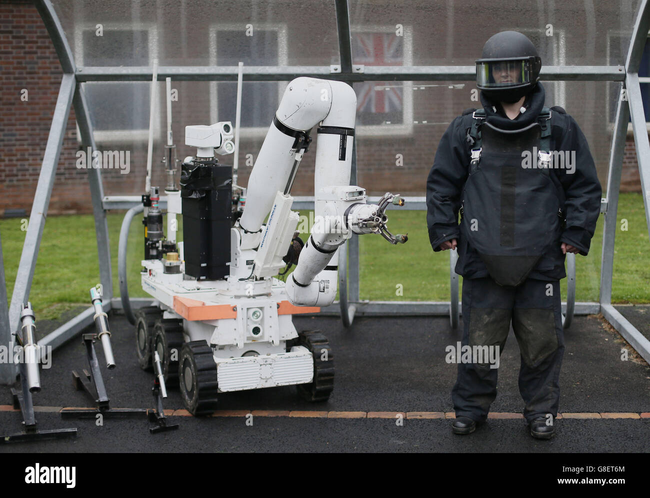 An Army Ammunition Technical Officer beside a Cutless remote controlled ...